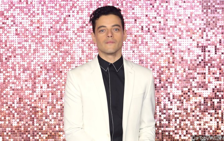 Rami Malek Gives Gold Treatment to His Fake Freddie Mercury Teeth