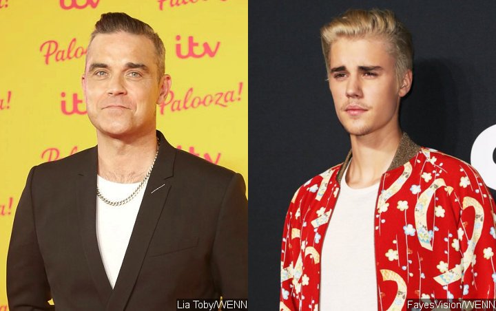 Robbie Williams Takes a Jab at Justin Bieber Over Christmas Album