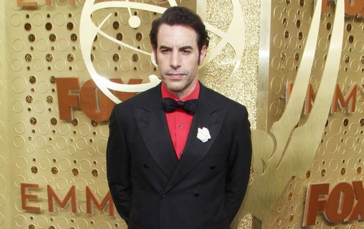 Sacha Baron Cohen Trolls Conservative Protesters as Country Music Singer