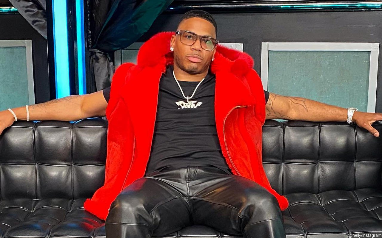Nelly Races Up Club Stairs Angrily After His Head Gets Hit With Object