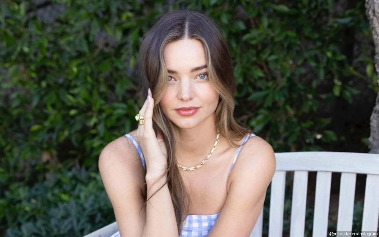 Miranda Kerr Flaunts Baby Bump in Stunning Red Dress for Christmas Eve