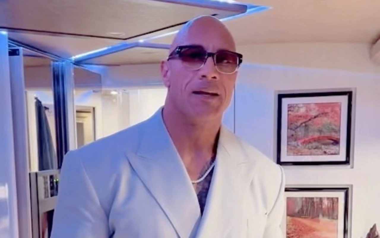 The Rock Drops F-Bomb During Heated Confrontation With Fan at WWE Hall ...