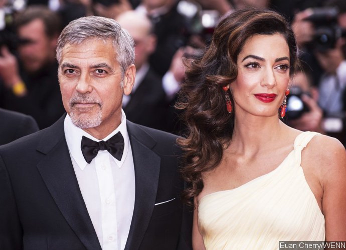 George and Amal Clooney Share Sweet Kiss During Romantic Dinner in Italy