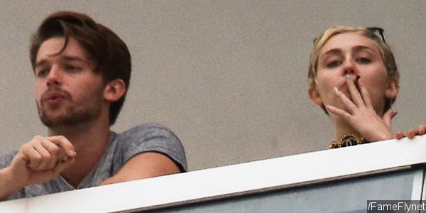 Miley Cyrus and Patrick Schwarzenegger Hit the Pool, Smoke Together