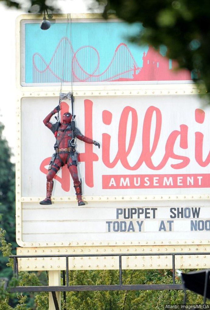 Deadpool Is Dangling in Front of a Billboard in New Set Photos of Sequel
