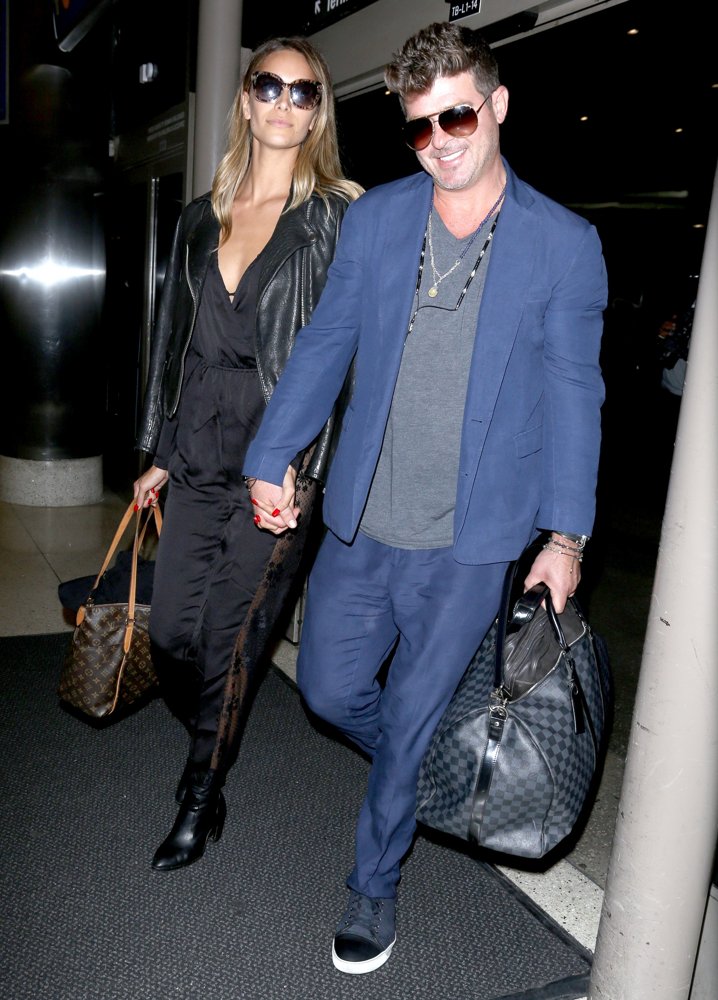 Robin Thicke and April Love Geary Arriving at Los Angeles International ...
